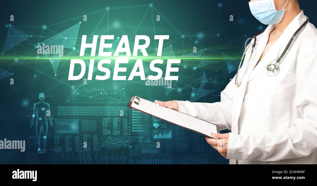 doctor writes notes on the clipboard with HEART DISEASE inscription ...