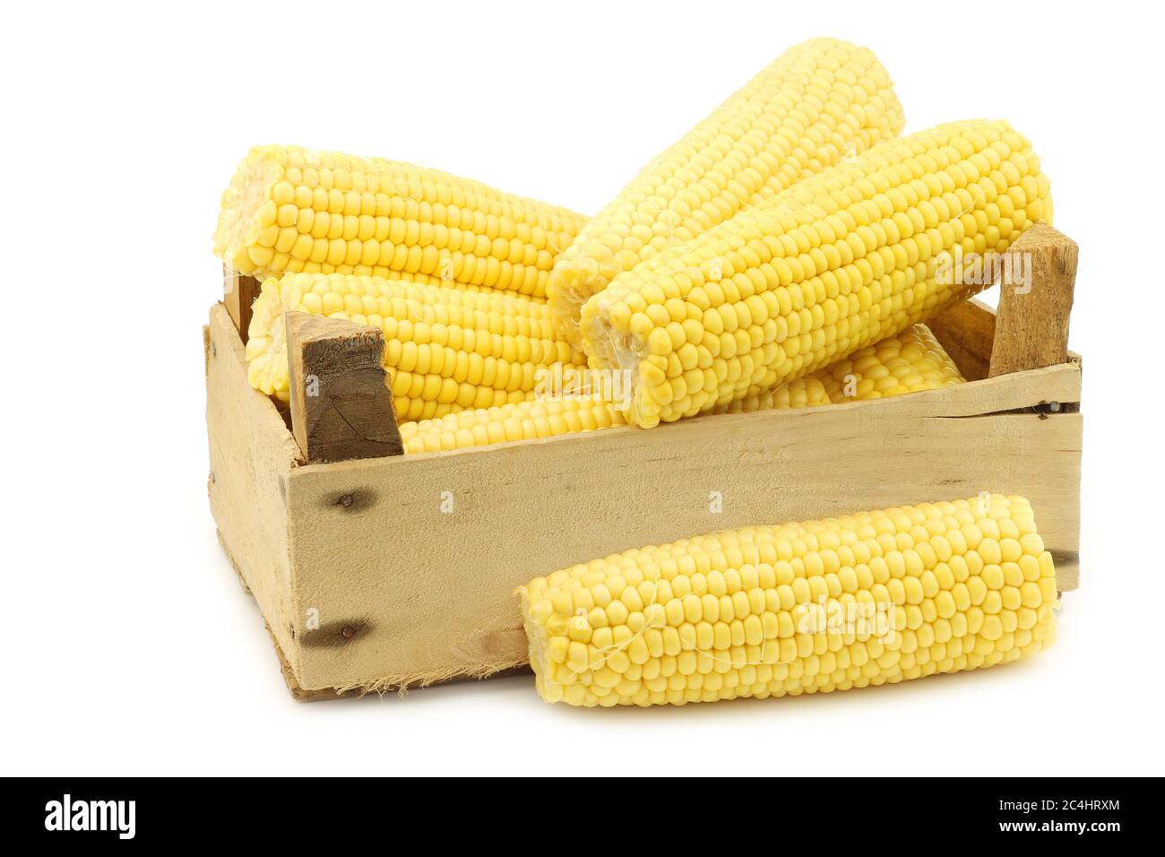 corn on the cob in a wooden crate on a white background Stock Photo - Alamy