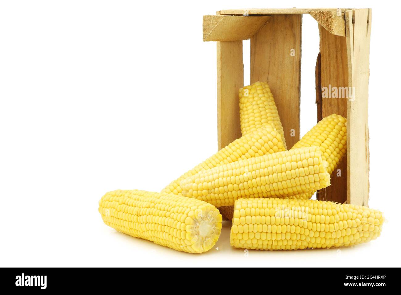 corn on the cob in a wooden crate on a white background Stock Photo - Alamy