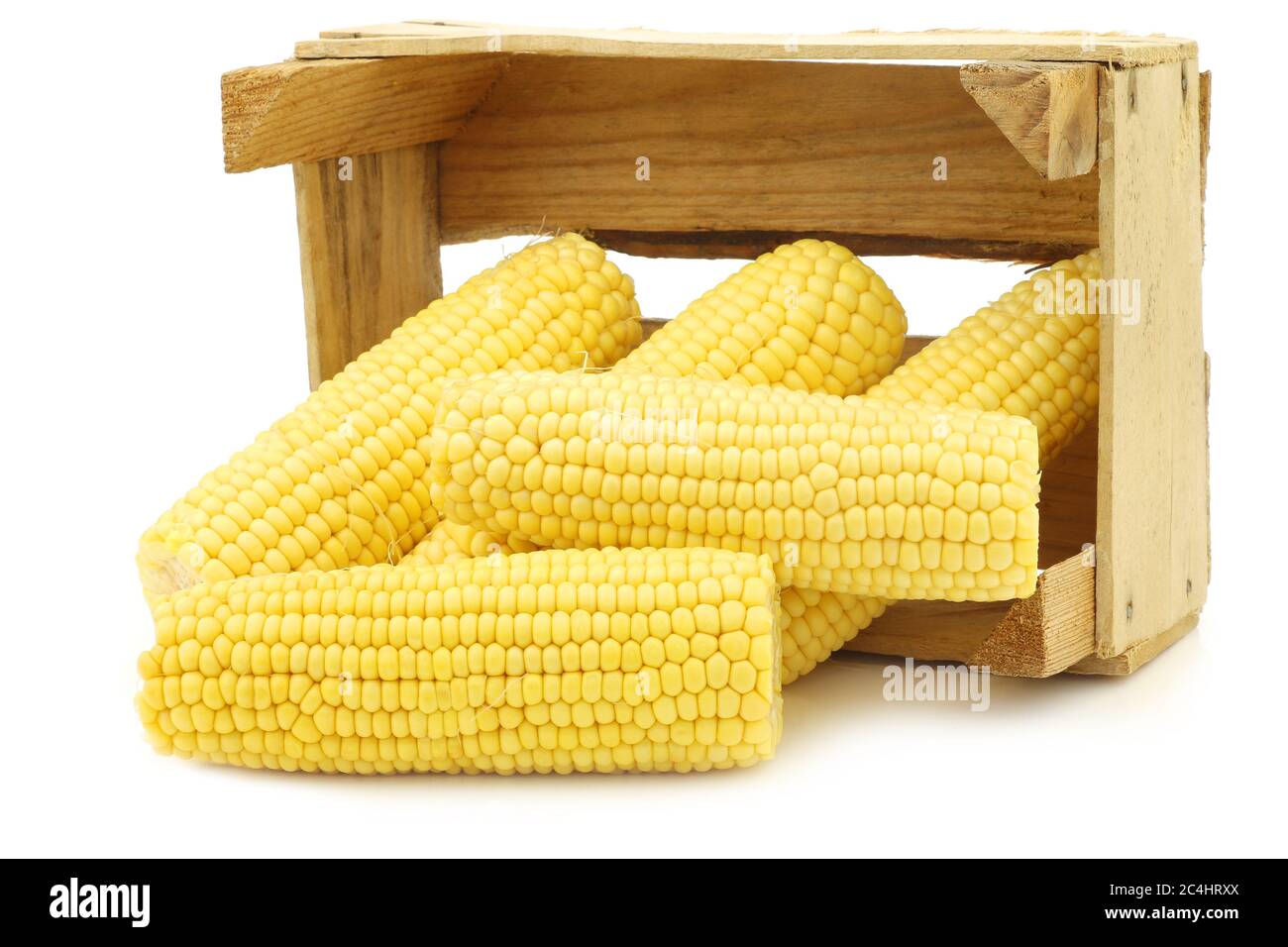 corn on the cob in a wooden crate on a white background Stock Photo - Alamy