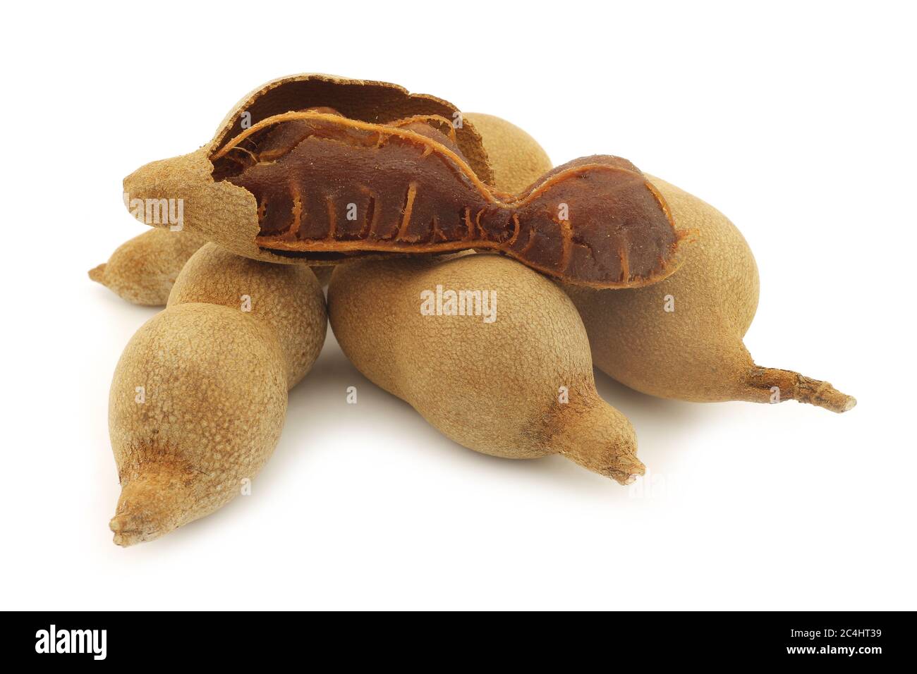 tamarind beans on a white background Stock Photo - Alamy
