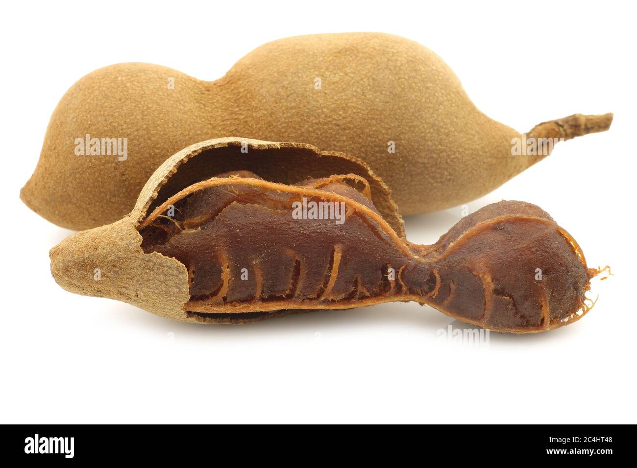 tamarind beans on a white background Stock Photo - Alamy