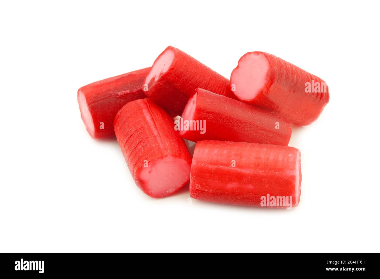 Red candy candy with pink filling on a white background Stock Photo - Alamy