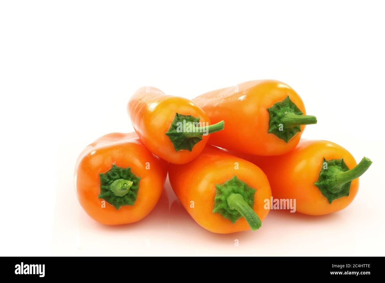 Orange peppers on plant hi-res stock photography and images - Alamy