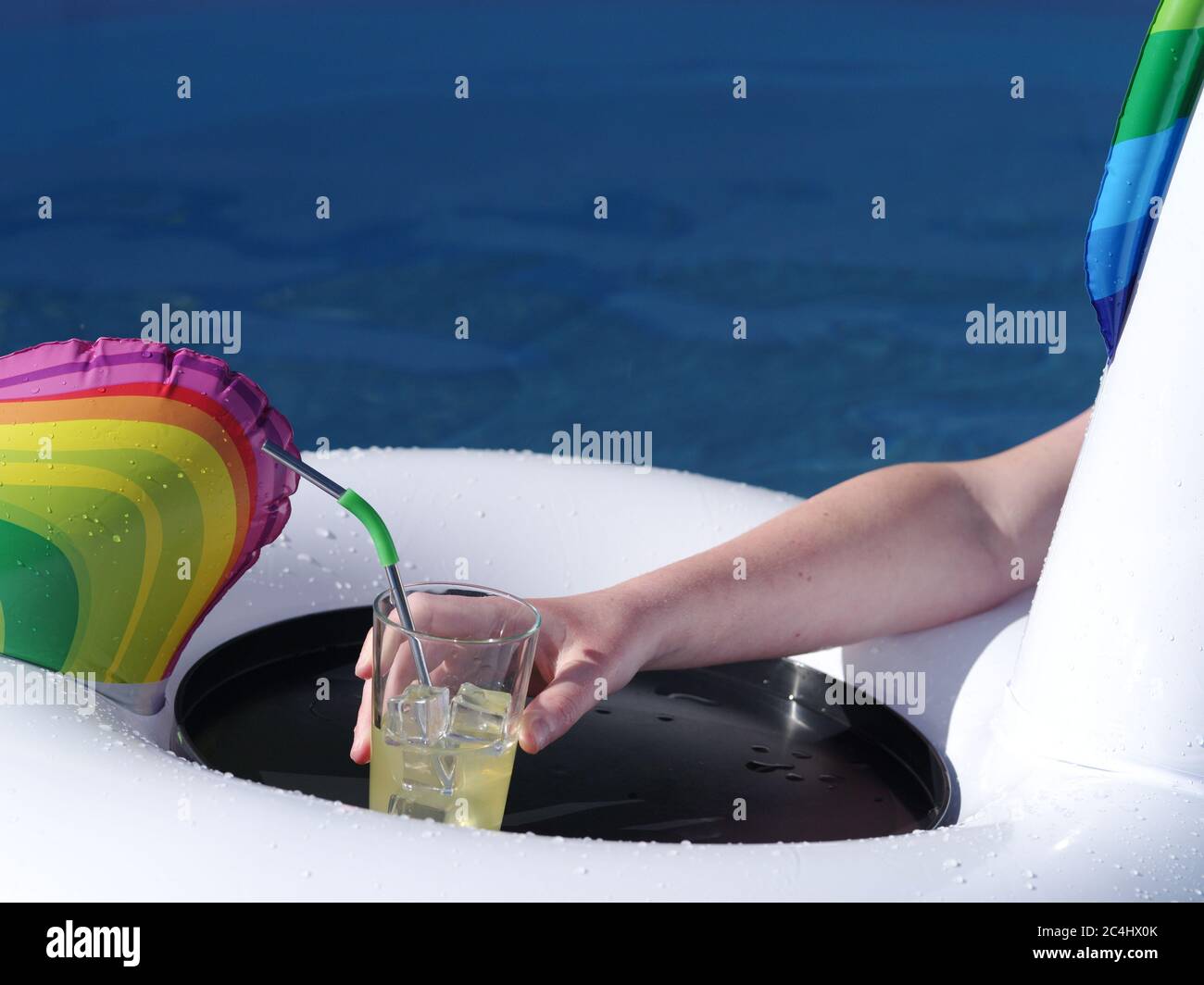 Swimming pool inflatable and drinks tray Stock Photo - Alamy