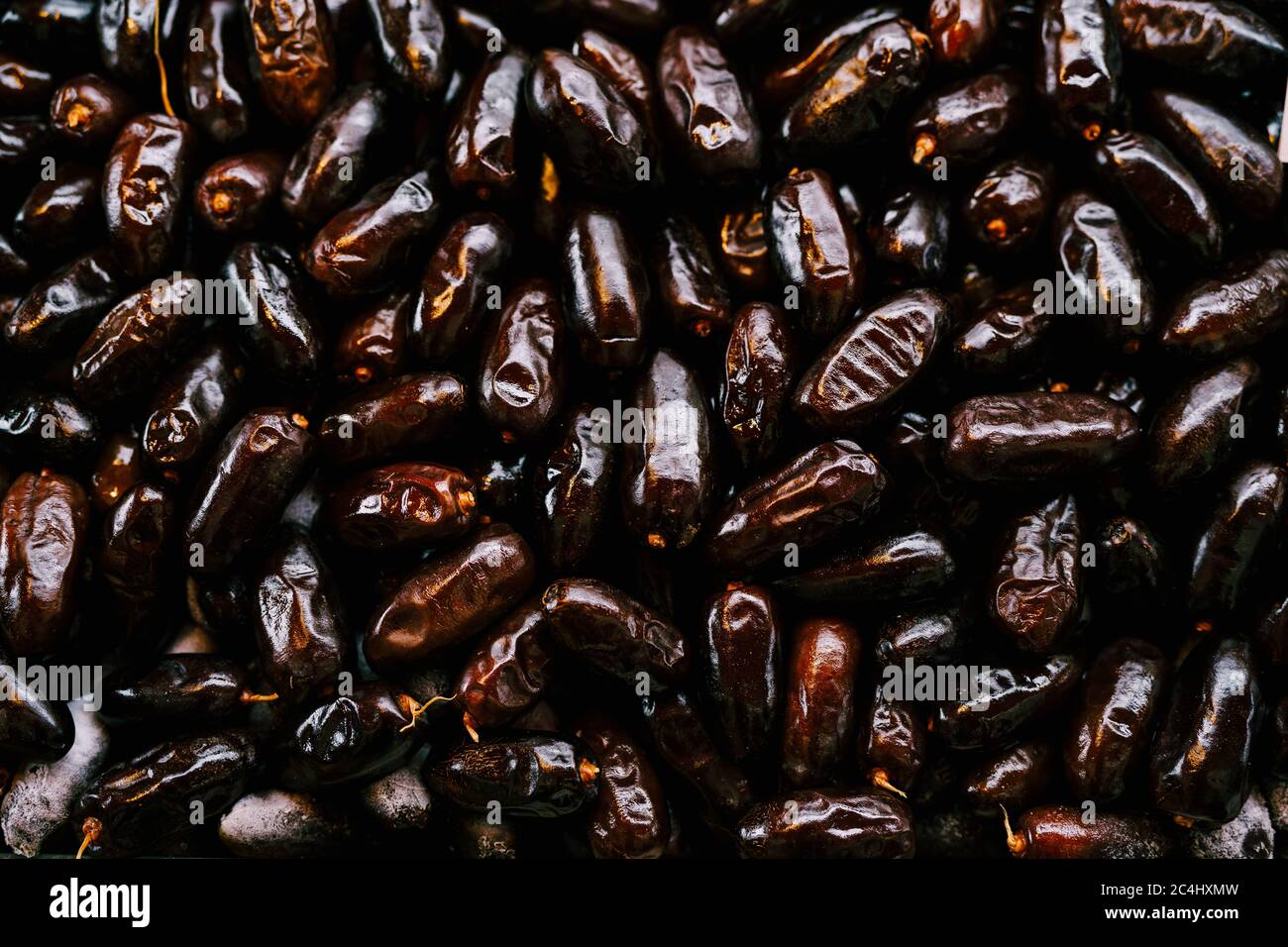 Close-up date fruit. The texture of dried fruit Stock Photo - Alamy