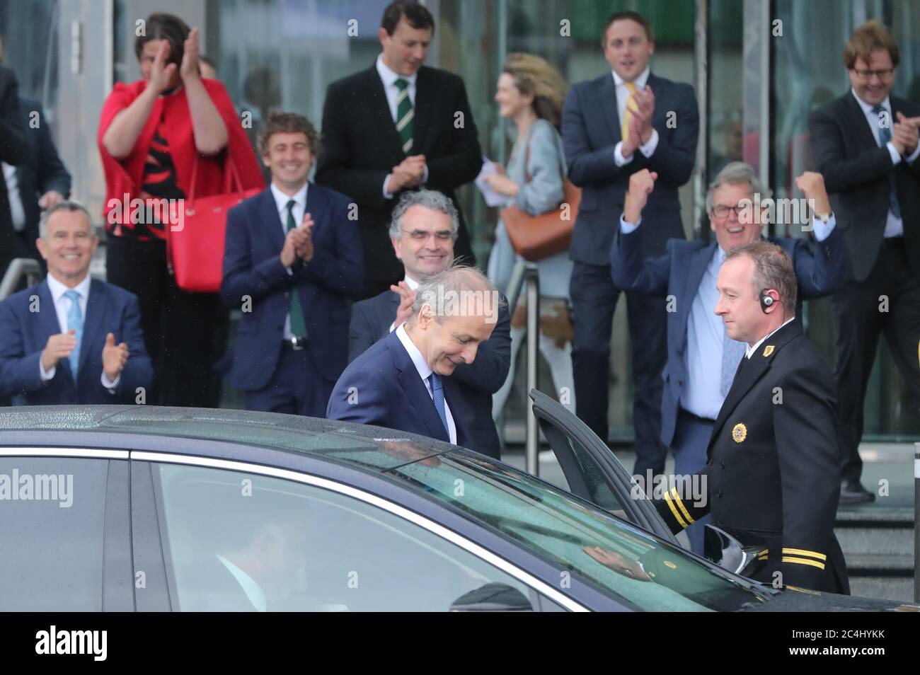 Party members cheer as Fianna Fail leader Micheal Martin leaves the ...