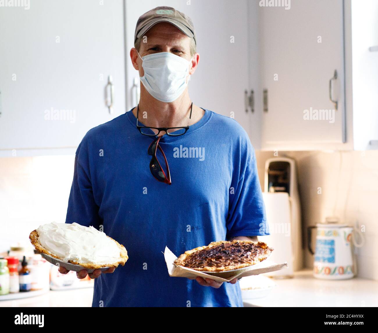 Man delivering pies during Covid pandemic Stock Photo - Alamy