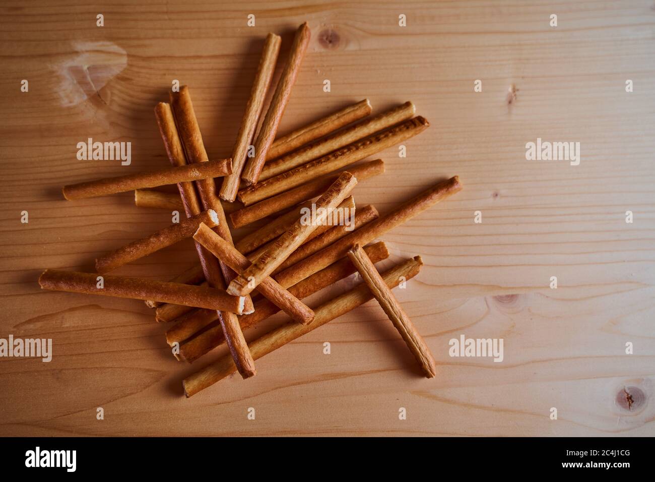 Bread sweet sticks on a wooden light board. Top view Stock Photo - Alamy