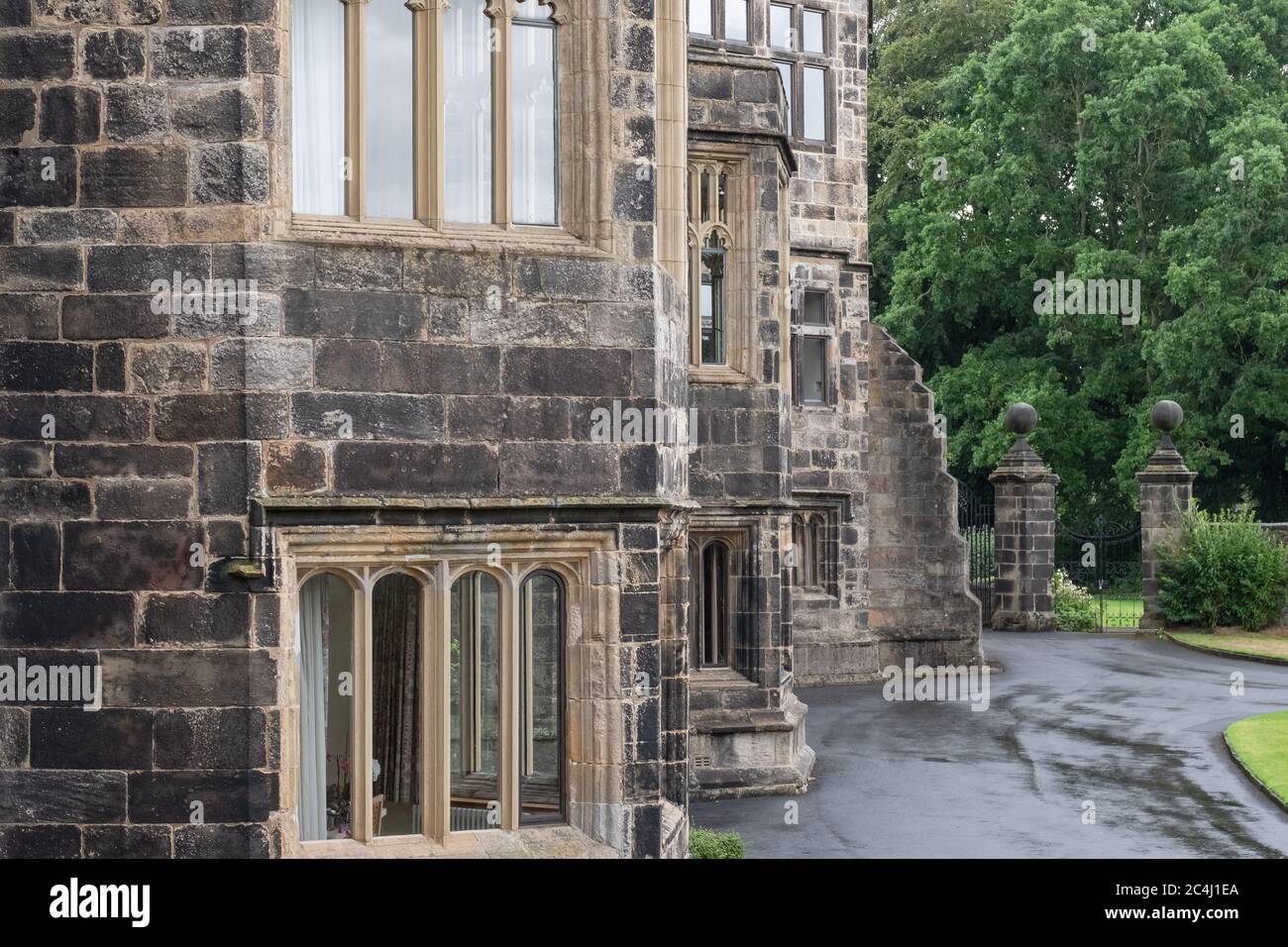Detailed view of an impressive, gothic styled large manor house showing ...