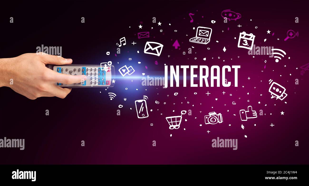 hand holding wireless peripheral with INTERACT inscription, social ...