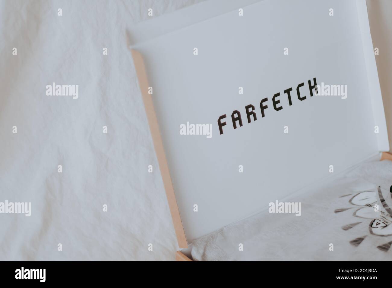 FARFETCH online luxury clothing store Stock Photo - Alamy