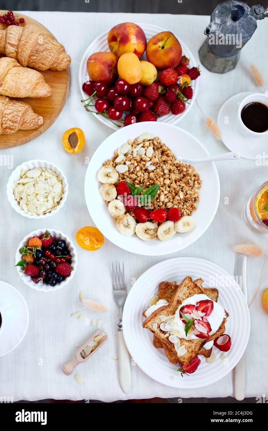 Fresh and bright continental breakfast table, abundance healthy meal ...