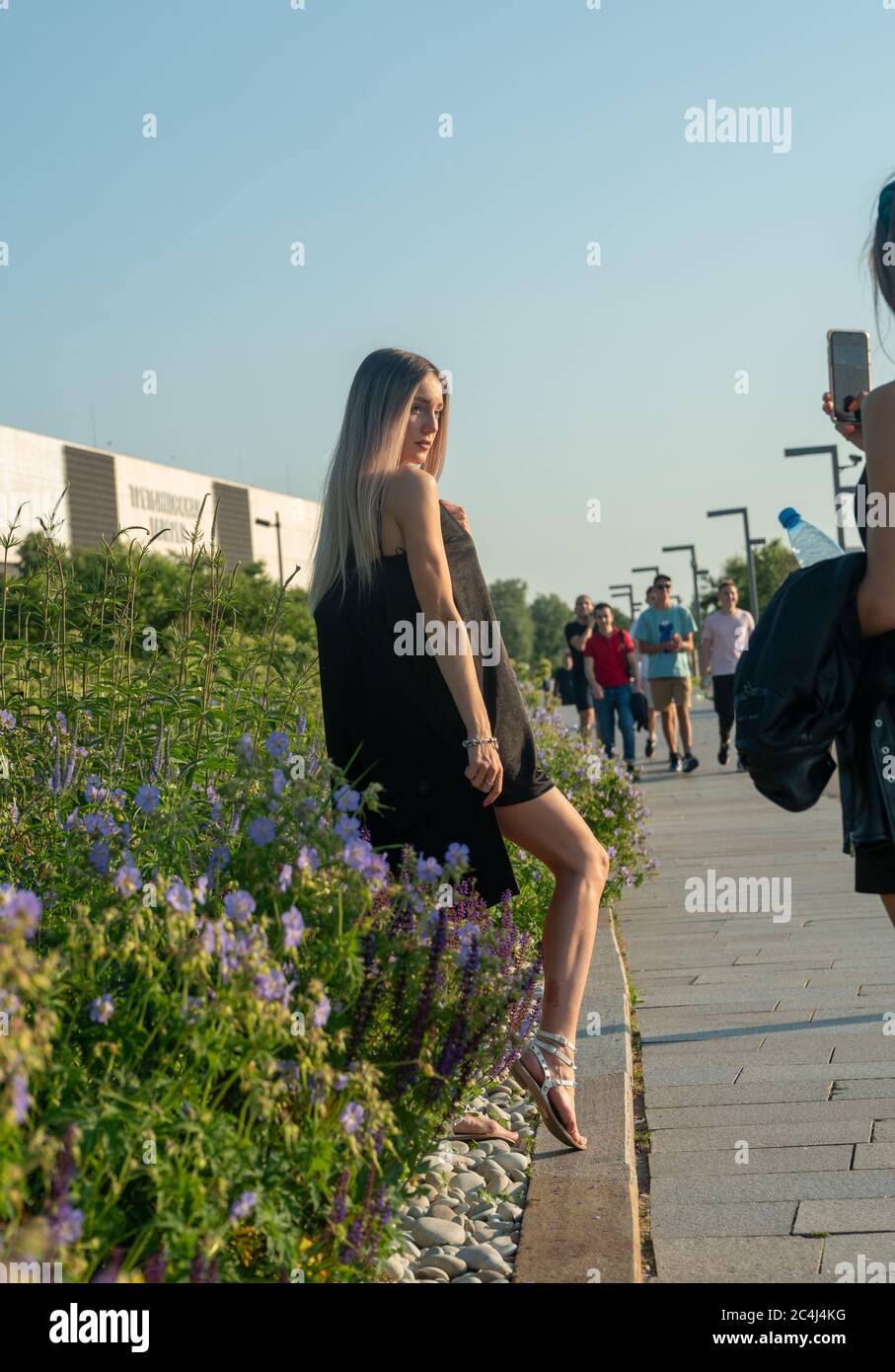 Russian girl posing for social network on Crimean Embankment. Amazinf ...