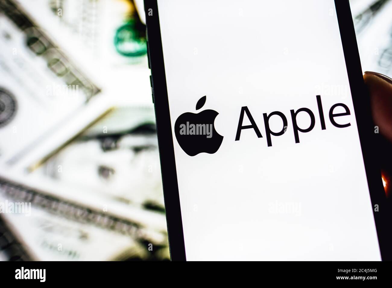 Hands holding iPhone X with Apple company logo on the screen Stock ...