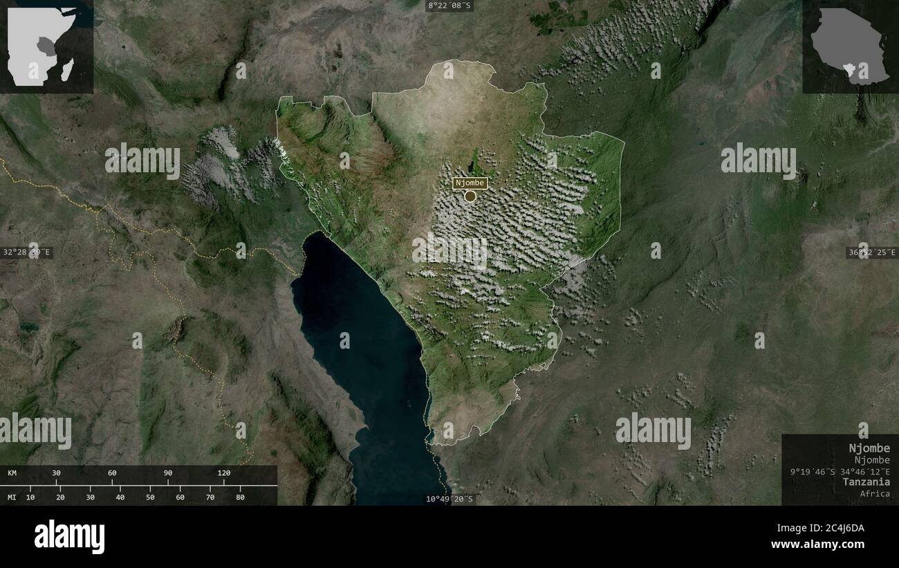 Njombe, region of Tanzania. Satellite imagery. Shape presented against ...