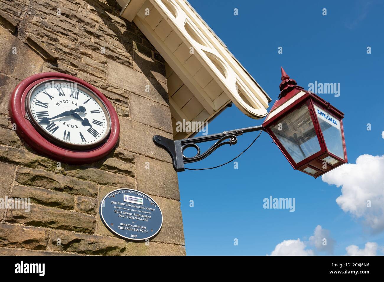 Ornate railway station clock and lantern seen on a station on the ...
