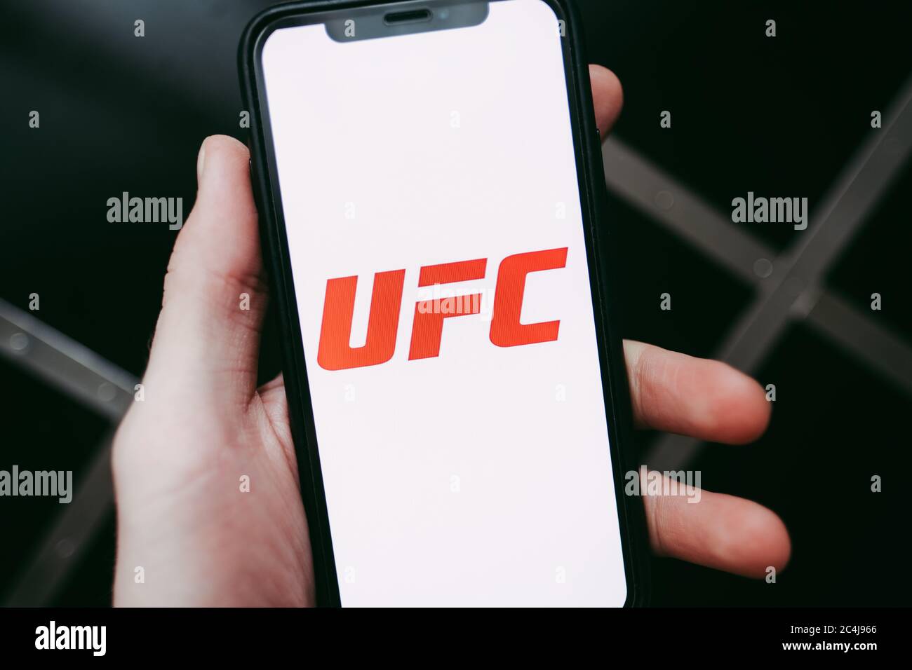 hands holding iPhone with UFC logo on the screen Stock Photo - Alamy