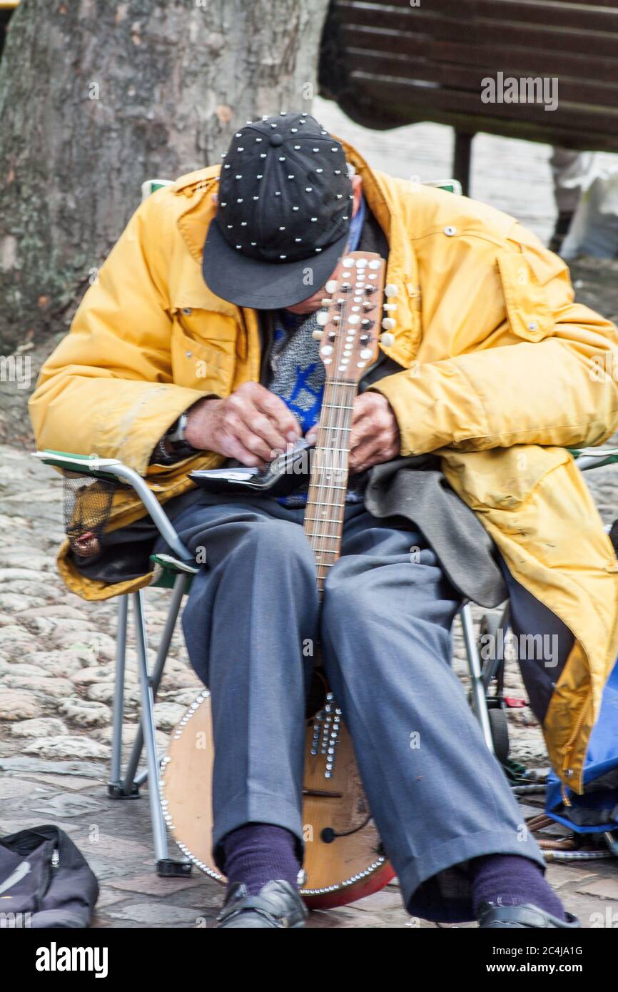 Old Man Busker Of Truro Having His Last Cigarette Stock Photo - Alamy