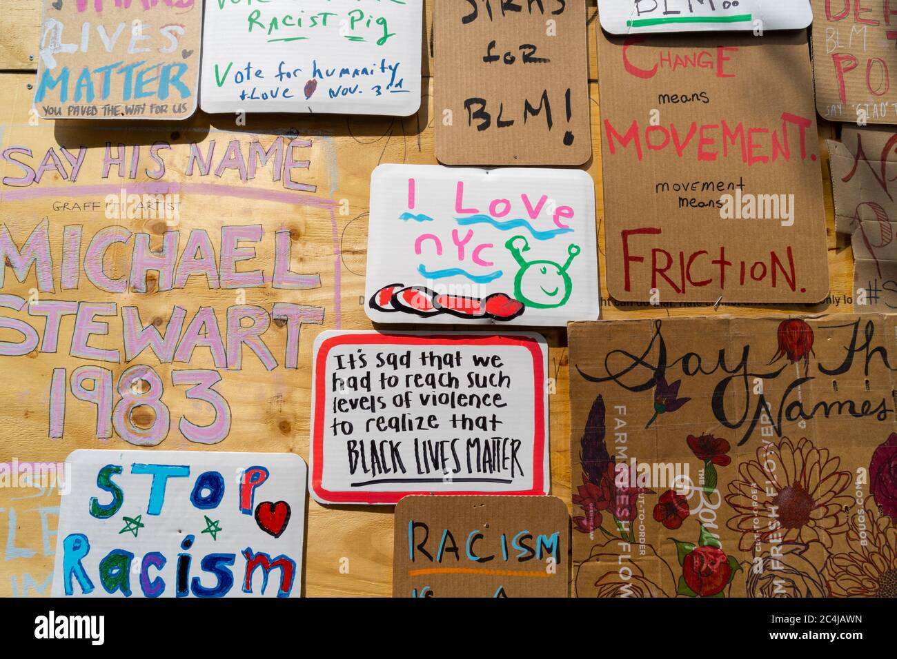 People write message of the BLM on barricade board at Fishs Eddy store ...