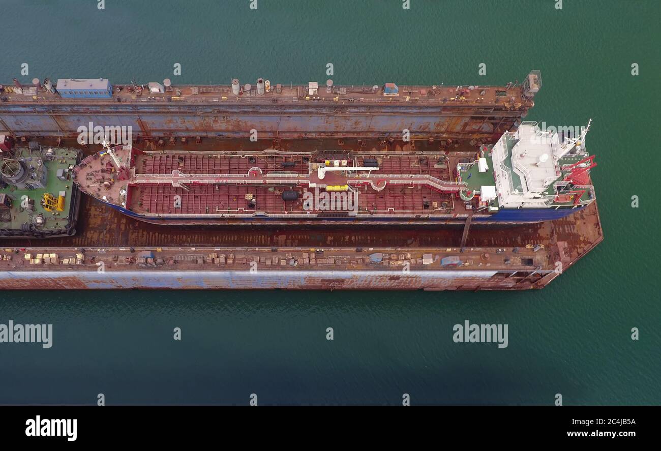 repair barge or tanker hull in shipyard Stock Photo - Alamy