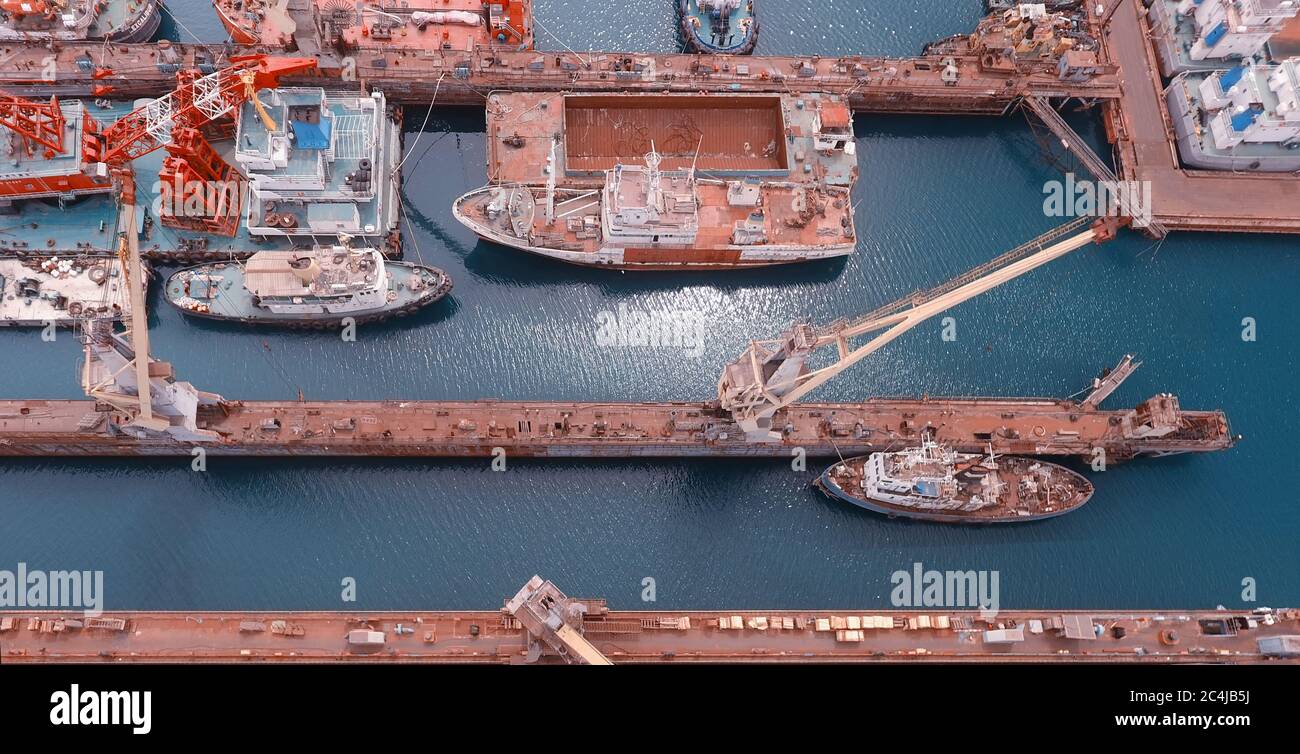 tugs in the port near the pier Stock Photo - Alamy