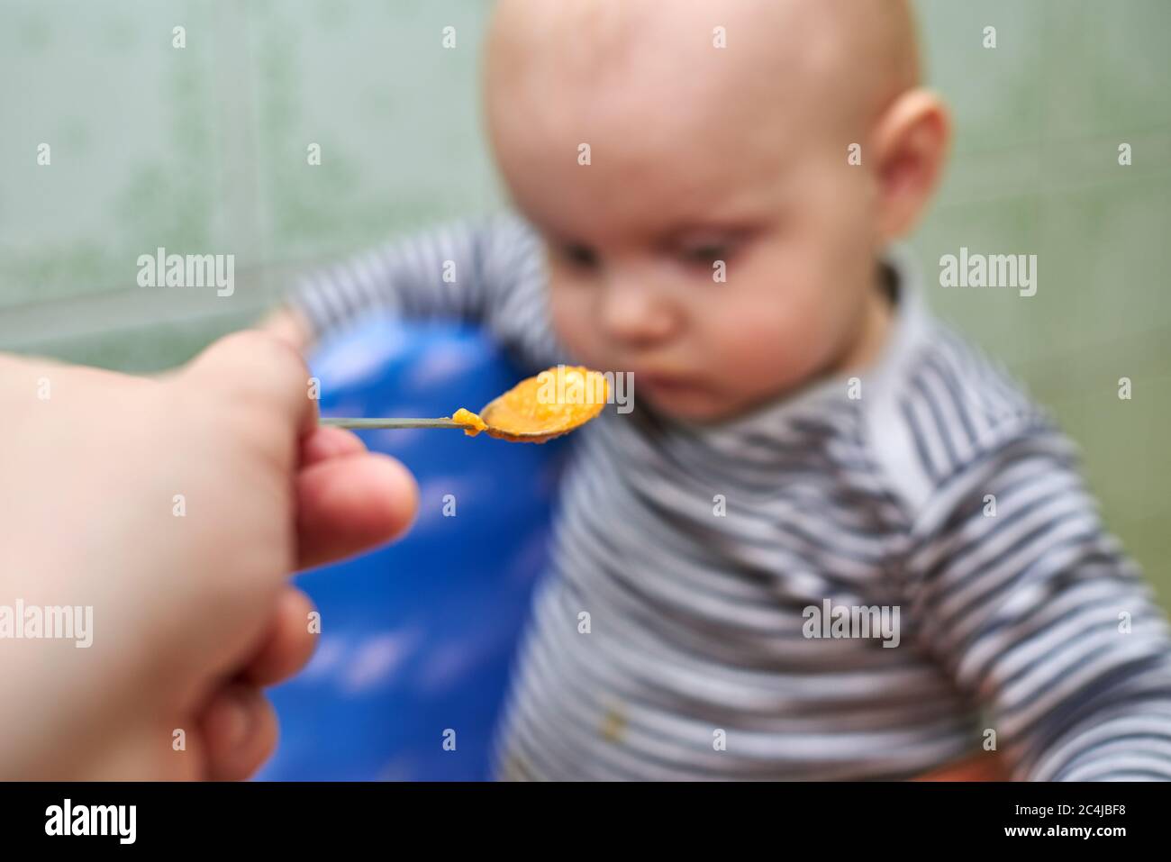 A little boy with a closed mouth does not want to eat Stock Photo - Alamy