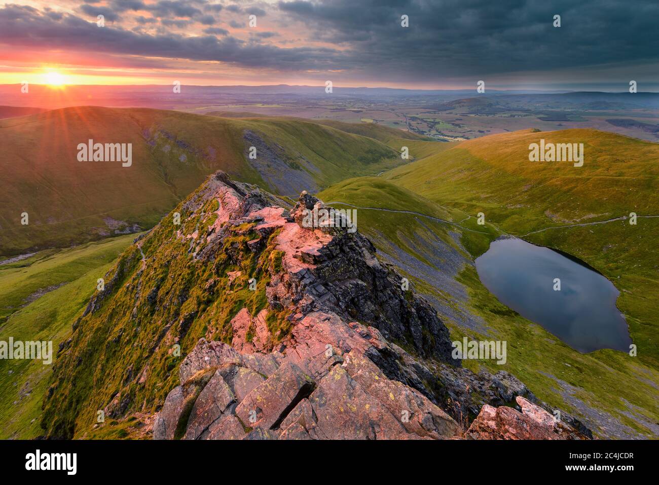 Stunning Sunrise On Blencathra Mountain Ridge With Small Tarn/Lake ...