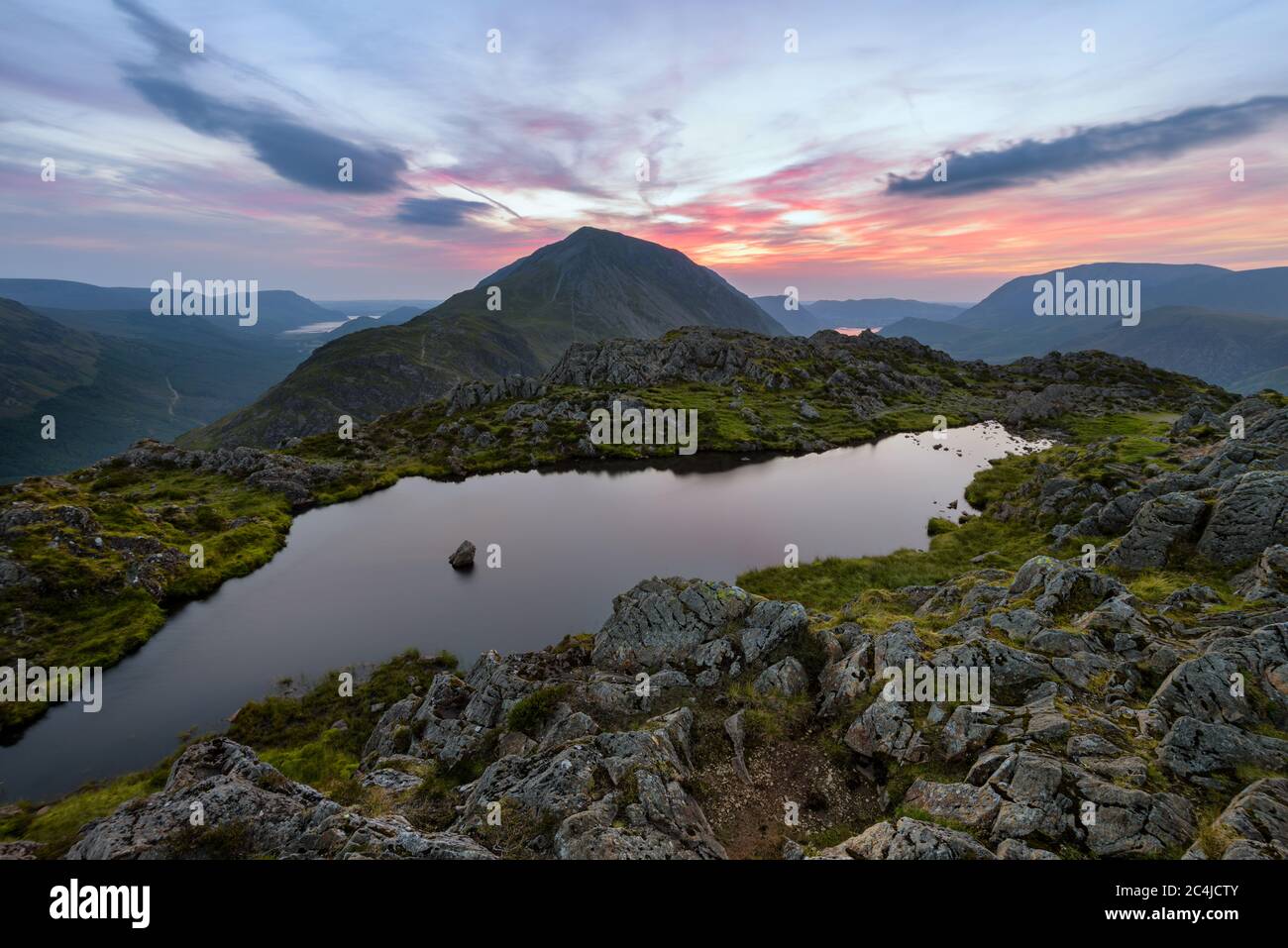 Beautiful Sunset In Lake District Mountains With Haystacks Tarn Stock ...