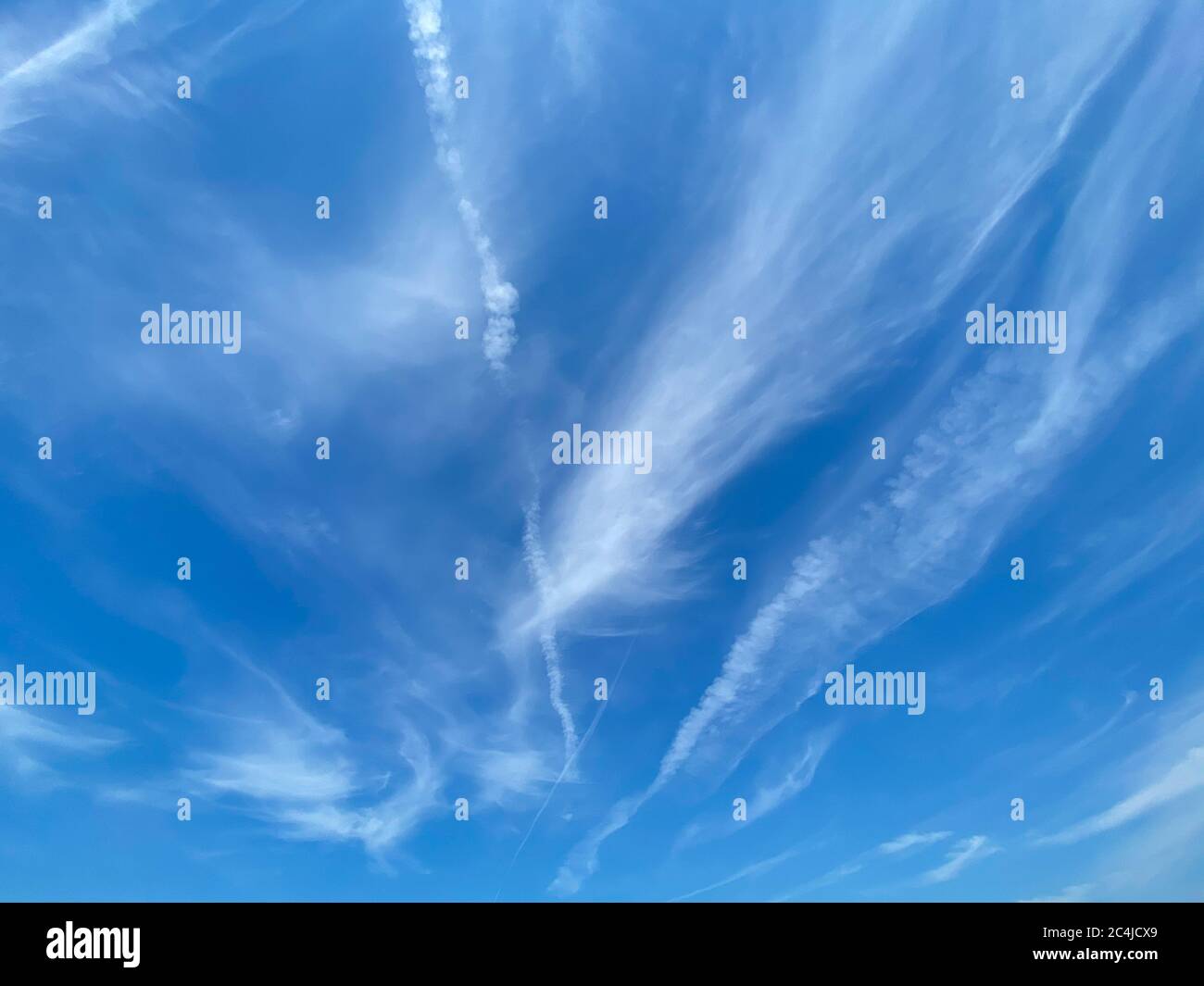 View into blue sky with thin whispy strands cirrus clouds Stock Photo ...