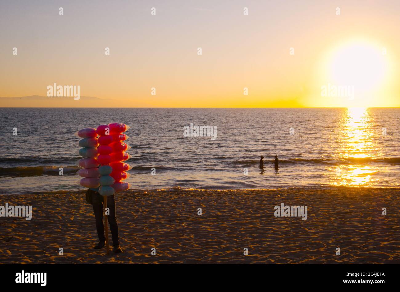Woman selling Cotton Candy at the beach in Puerto Vallarta Mexico, as ...
