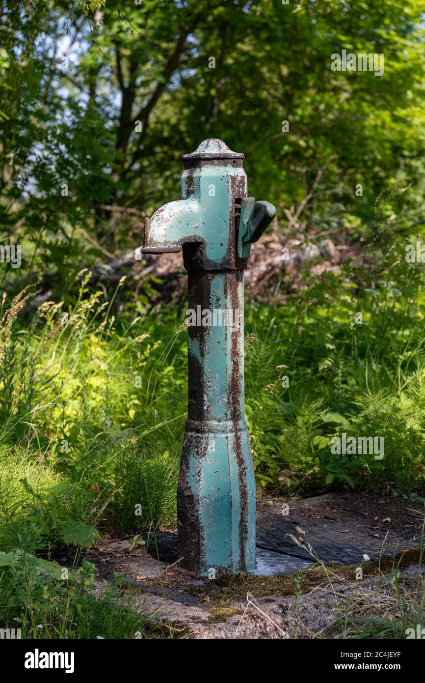 Old rusty drinking water fountain in Vallisaari, former military island ...