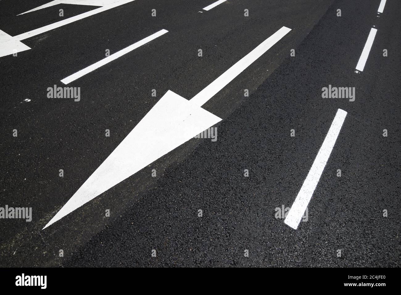 Arrow directional signals painted on the floor in Spain Stock Photo - Alamy