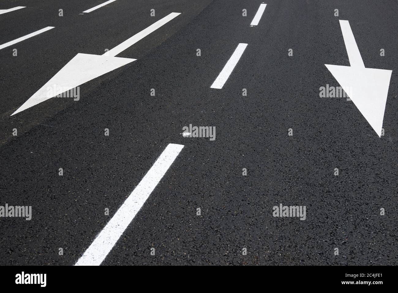 Arrow directional signals painted on the floor in Spain Stock Photo - Alamy