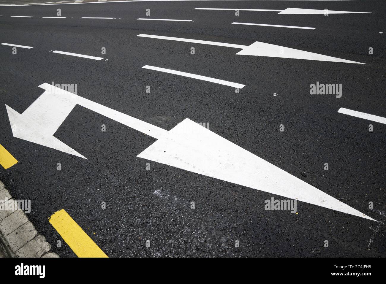 Arrow directional signals painted on the floor in Spain Stock Photo - Alamy