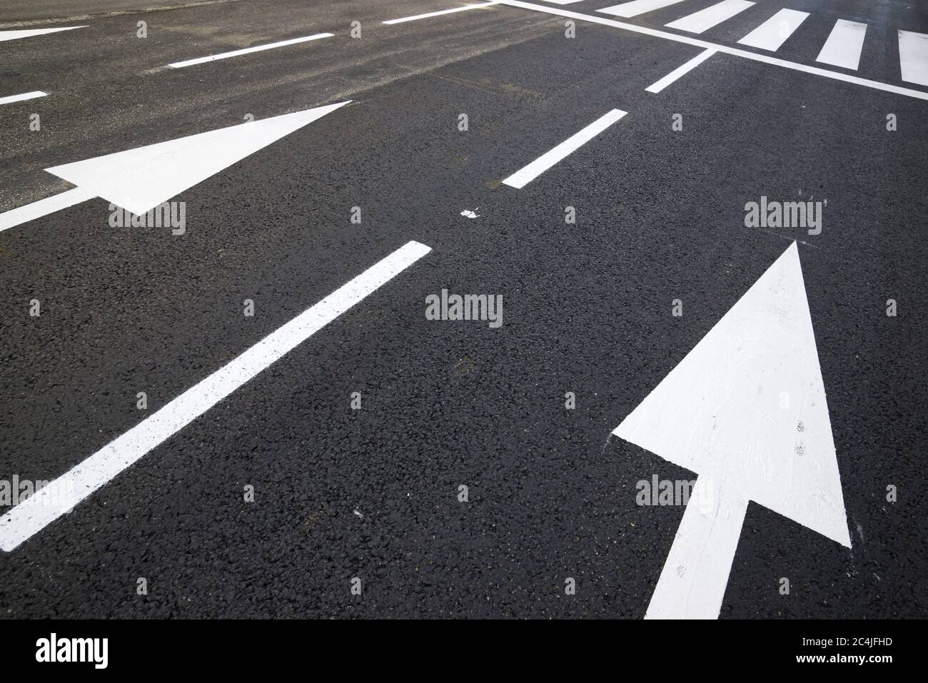 Arrow directional signals and zebra crossing painted on the floor in ...