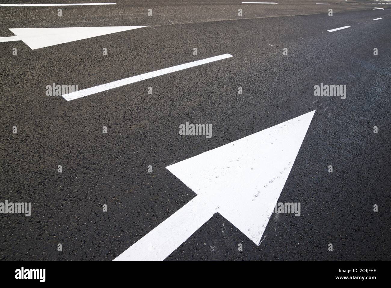 Arrow directional signals painted on the floor in Spain Stock Photo - Alamy