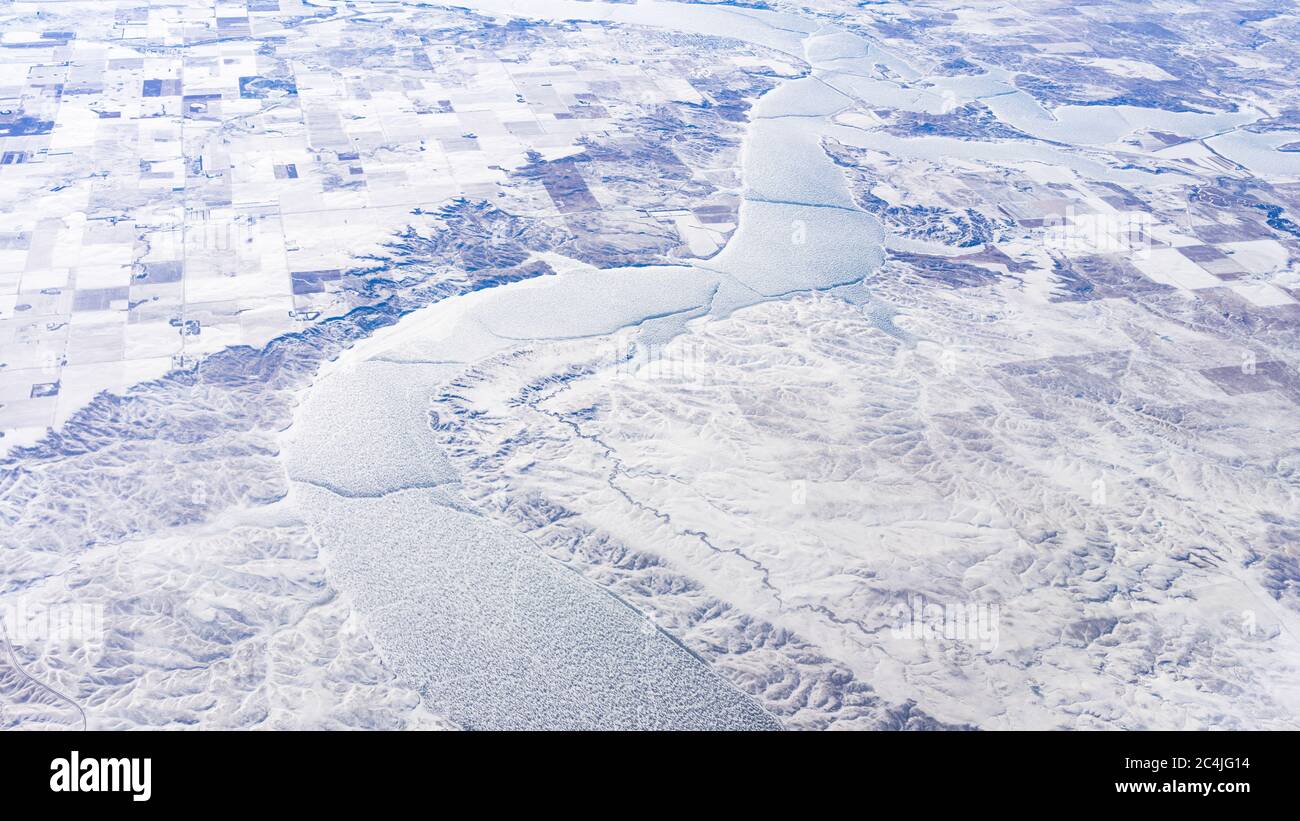 Ice covered river from a plane window in central US Stock Photo - Alamy