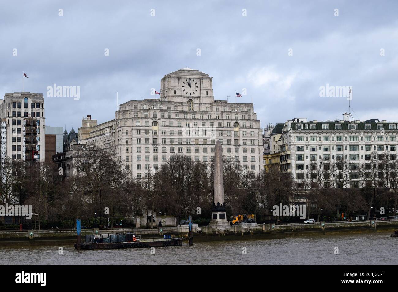 Photo of Shell Mex Building Across River Thames on a cloudy day Stock ...