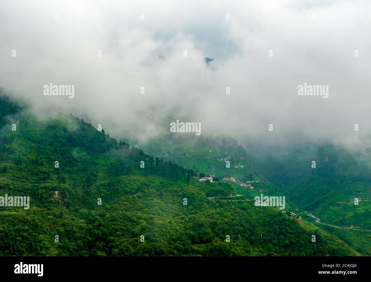 A beautiful view of the low monsoon clouds over the mountain ranges at ...