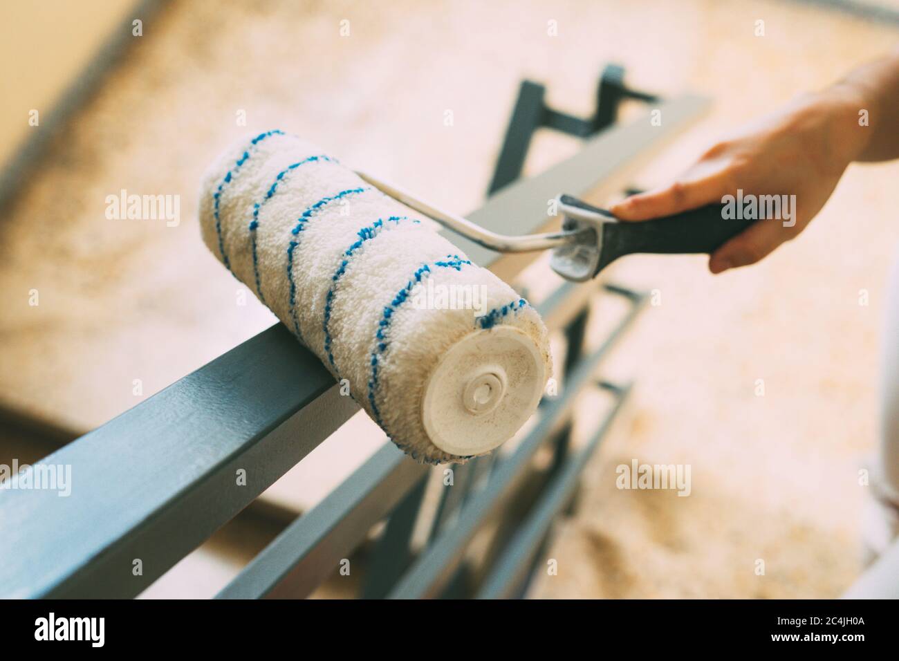 Painter painting with a brush paint roller. Painter concept Stock Photo ...