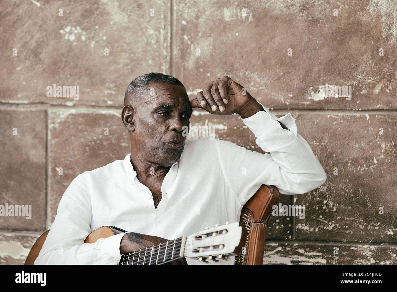 Cuban musician playing with his group in the streets of Havana, Cuba ...