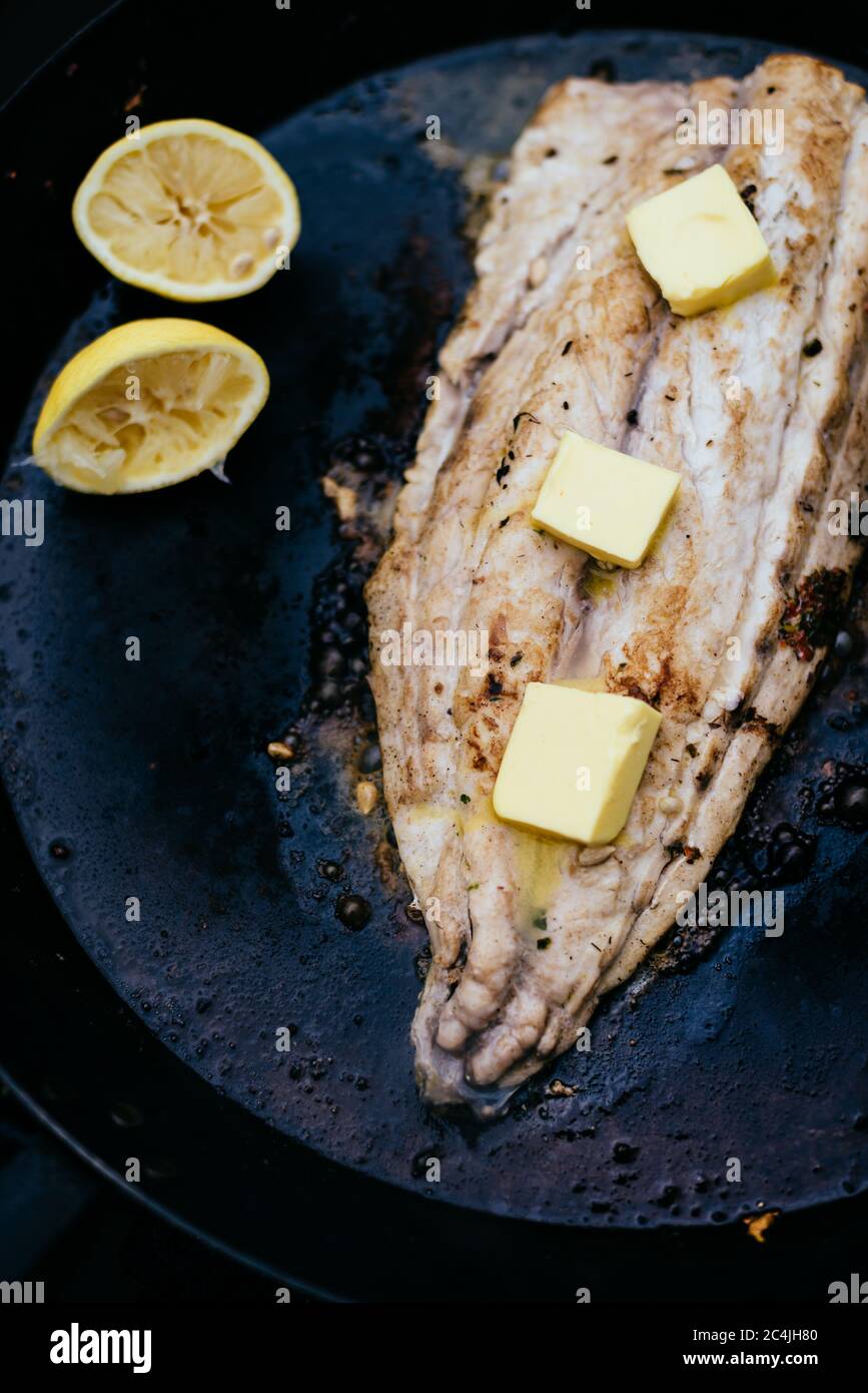 Frying yellowtail amberjack with butter, lemon, Port Elizabeth/Nelson ...