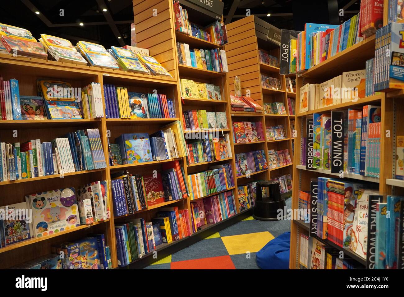 Children drawing and coloring books on shelves in a bookstore for sale ...