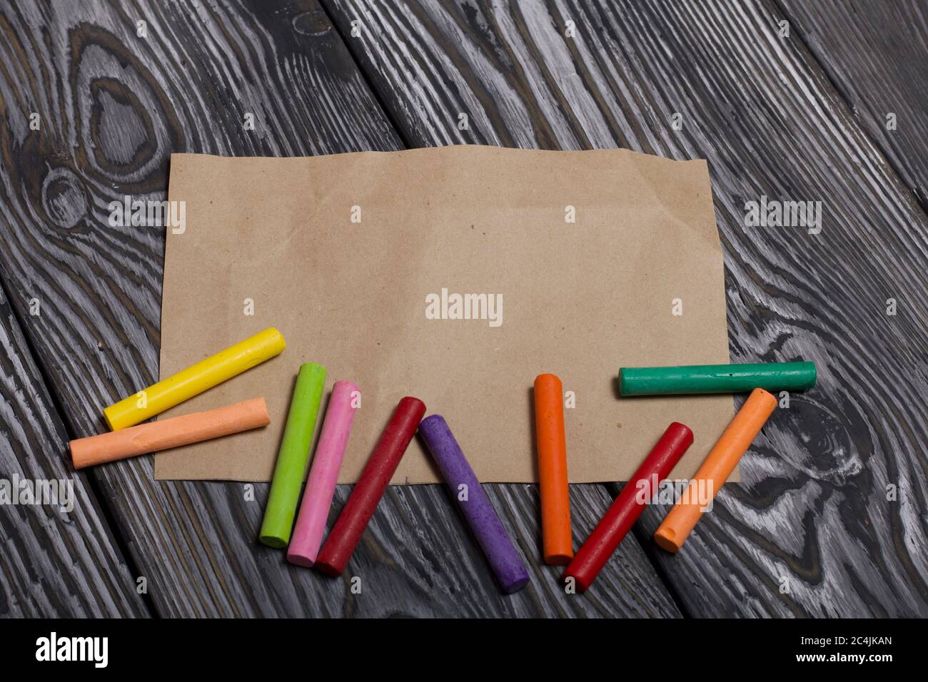 Pastel for drawing and a sheet of paper. Sticks of different colors ...
