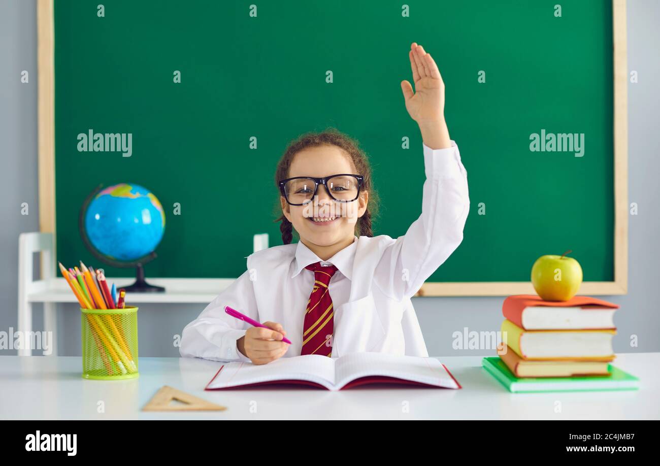 Children hands up school uniform hi-res stock photography and images ...