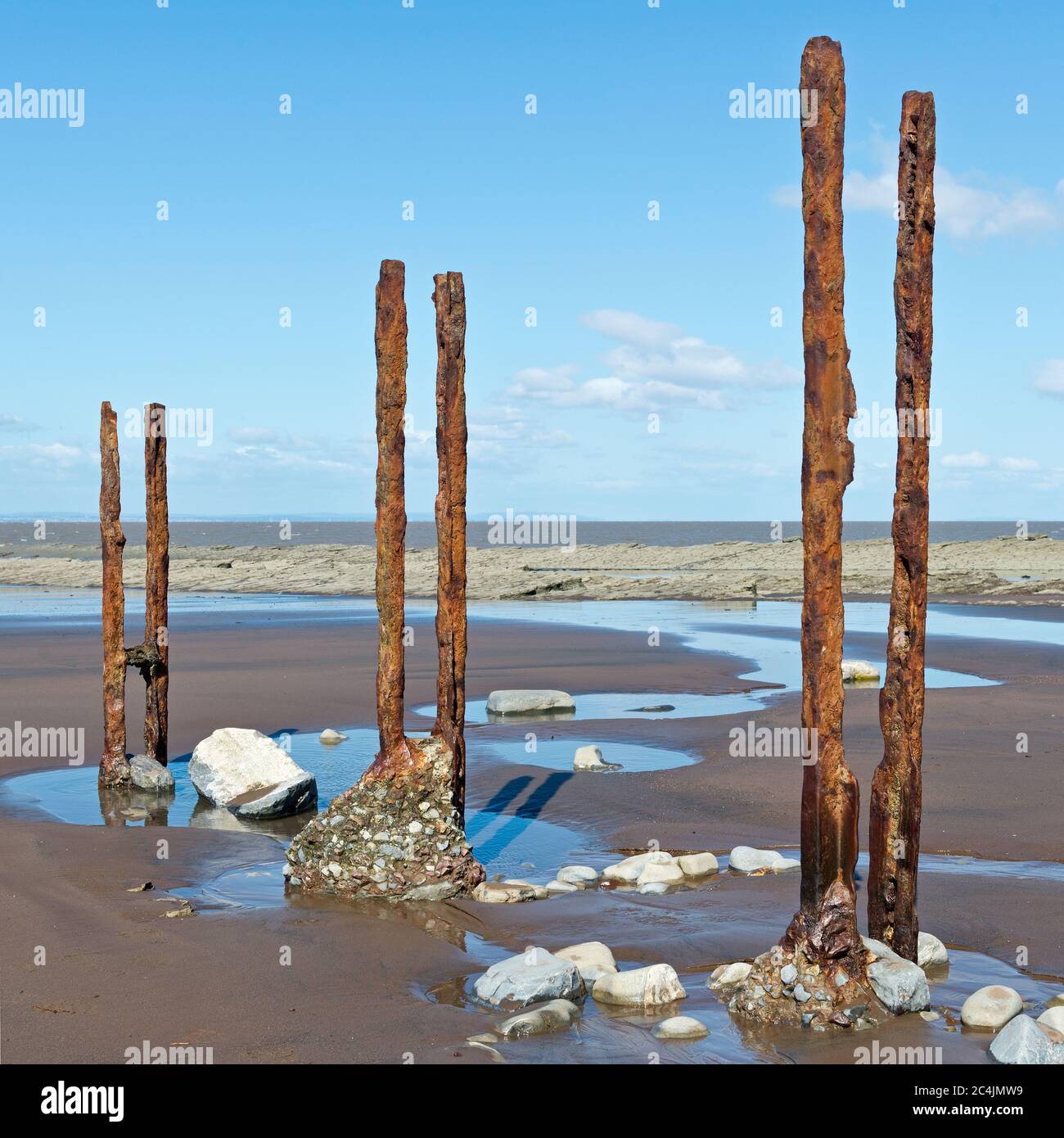 The remains of old groynes on the beach in St Audries Bay on the ...