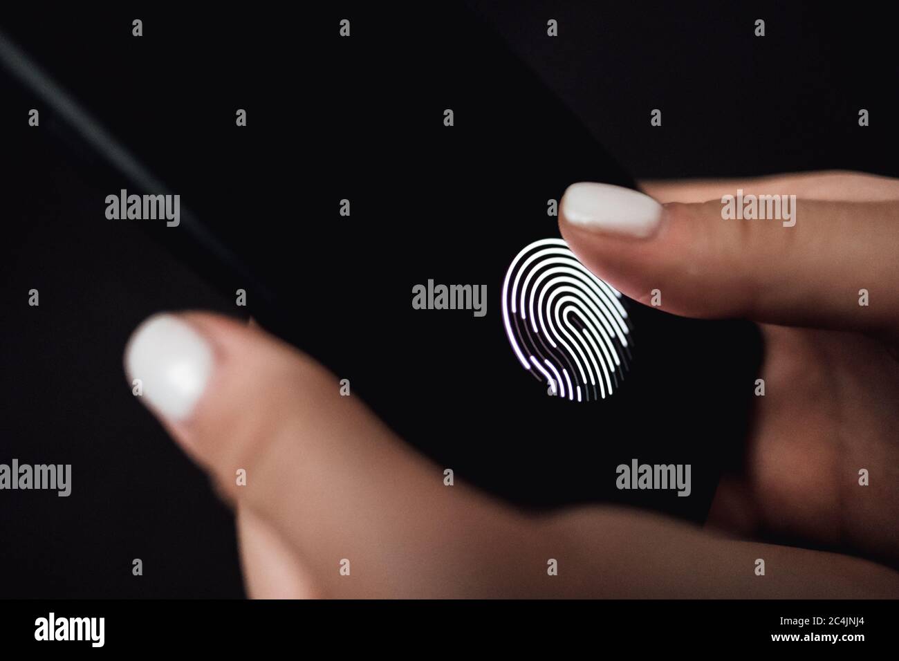 Hands holding smartphone with fingerprint scanner in the screen Stock ...