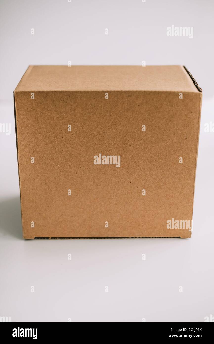 Empty blank cardboard box mock up, the parcel on a white table ...
