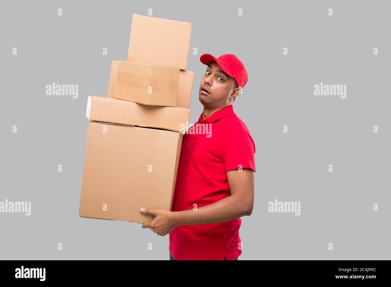 Delivery Man Holding a lot Carton Boxes Isolated. Indian Delivery Boy ...